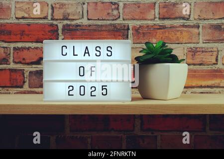 Class of 2025 alphabet letter on wooden background Stock Photo - Alamy