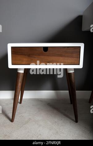 Interior of living room with wooden commode, folding screen and blank ...