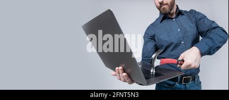 man breaking pc with hammer Stock Photo - Alamy