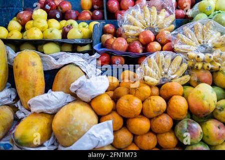 Colorful fruit stand with papayas, tangerines, bananas, and more Stock ...