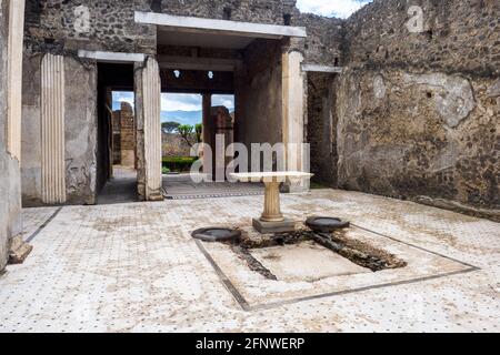 Square atrium which has a central impluvium. The floor of the atrium ...
