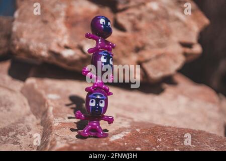violet ninja figurines standing on each other Stock Photo - Alamy
