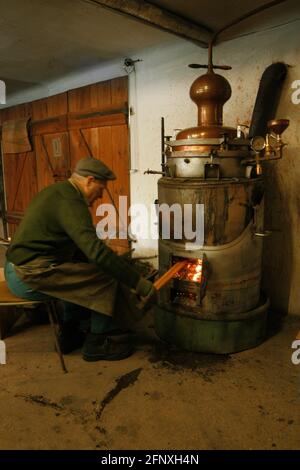 farmer distilling schnapps, Austria Stock Photo - Alamy
