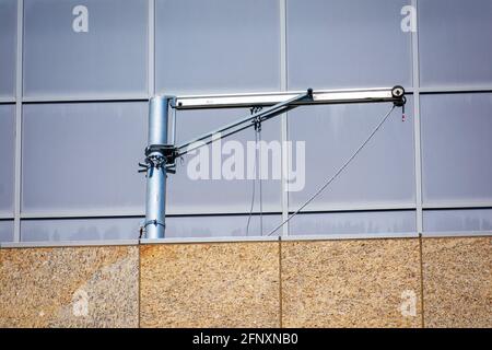 Davit suspension system is attached to the building roof structure ...
