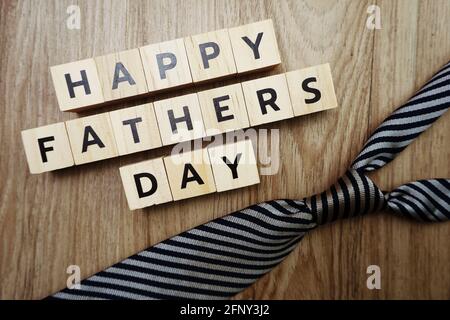 Happy Father's Day alphabet letters with necktie on wooden background ...