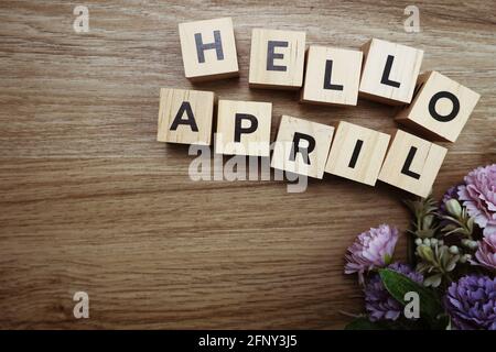 Hello April alphabet letters on green glitter background Stock Photo ...