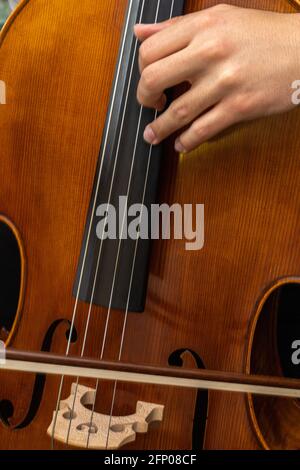 Young music student playing a cello Stock Photo - Alamy