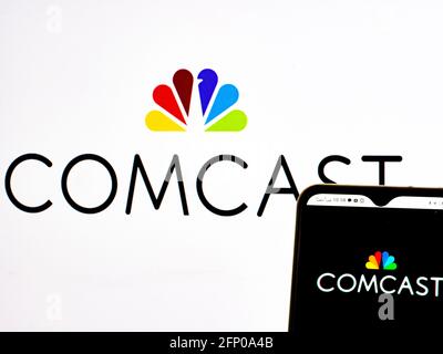 In this photo illustration, Comcast Corporation logo seen displayed on ...
