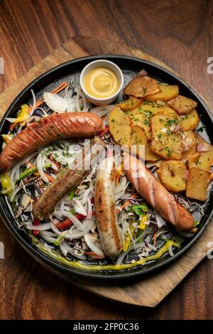 mixed german traditional organic sausage and potato meal platter ...