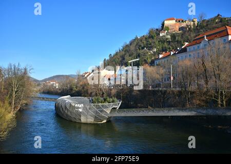 Scenic view of the steel footbridge of Murinsel, the peculiar seashell ...