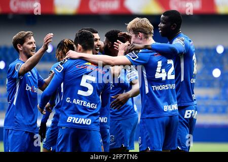 Genk's players celebrate after scoring during a soccer match between ...