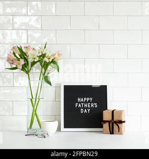 Happy Fathers Day concept. Letterboard, gift box, coffee cup, boquet of ...
