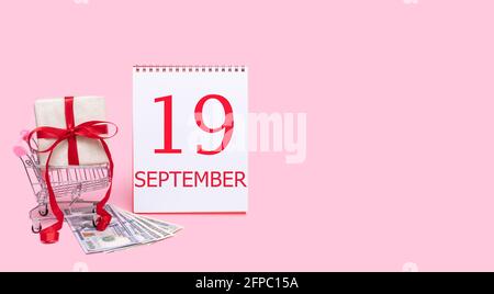 September 19th. Day 19 of month, Calendar date. White alarm clock on ...