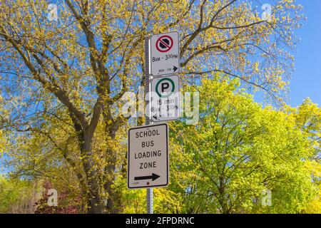 school bus loading zone sign left road street Stock Photo - Alamy
