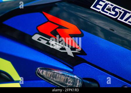 A Suzuki GSX S 1000 motorcycle parked in front of two trees in ...