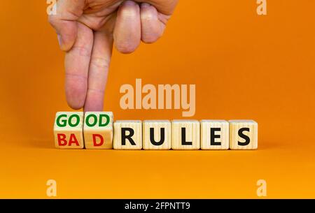 Good or bad rules symbol. Businessman turns wooden cubes and changes ...