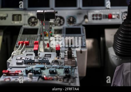 Airplane cockpit with thrust levers and instrument panel Stock Photo ...