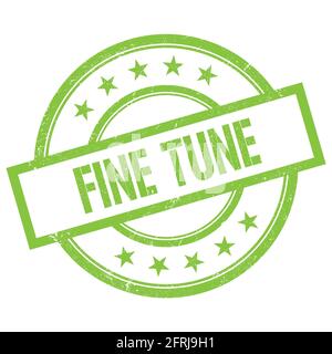 FINE TUNE text on green grungy round vintage stamp Stock Photo - Alamy