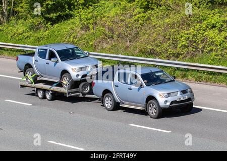 Mitsubishi L200 pickup truck side view isolated on white background ...
