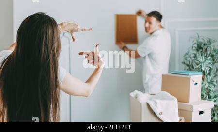 young couple arranging things in their new apartment Stock Photo - Alamy