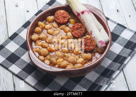 Chickpea stew with chorizo and radishes Stock Photo - Alamy