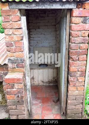 Old fashioned outside wooden toilet built in garden shed, Suffolk, UK ...