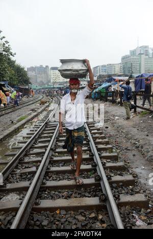 Poor Bangladeshis living by the railway track in the Karwan ...