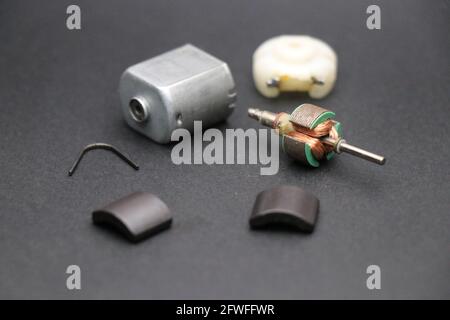 Parts of a dc motor that was disassembled to have a look at all the ...