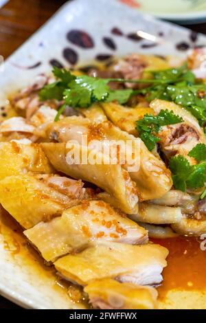 A delicious classic Cantonese dish, white-cut chicken in soy sauce ...
