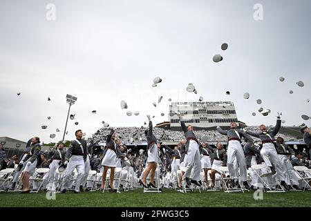 West Point graduates toss their hats in the air after the conclusion of ...