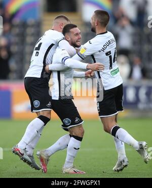 Swansea City's Jake Bidwell (centre) and Barnsley's Mads Andersen ...