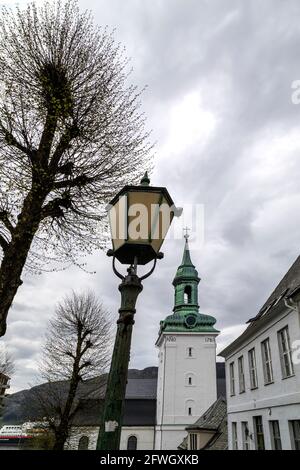 Tower of Nykirken white stone parish church in the port area of Nordnes ...