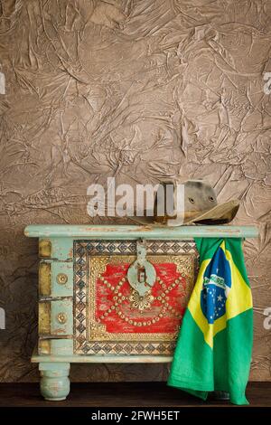 stylish pirate chest with travel hat, Brazilian flag and old maps ...
