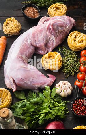 Whole raw rabbit meat set, on old dark wooden table Stock Photo - Alamy