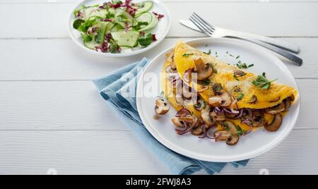 High a angle of fresh vegetarian omelet with chopped vegetables ...