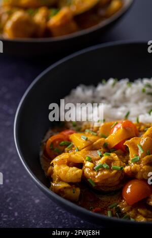 Monkfish and prawns curry Stock Photo - Alamy