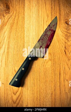 kitchen knife on the floor stained with blood Stock Photo - Alamy