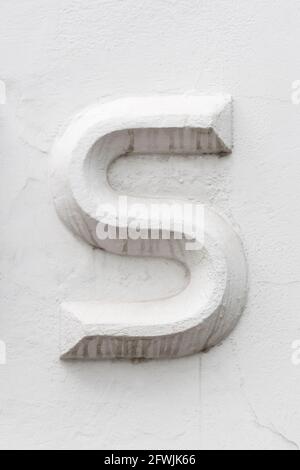 White stucco letter T on white ground Stock Photo - Alamy