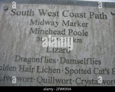 Porthallow village. South west coast path midway halfway point sign ...