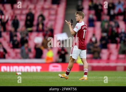 Arsenal's Martin Odegaard applauds the fans following the Premier ...