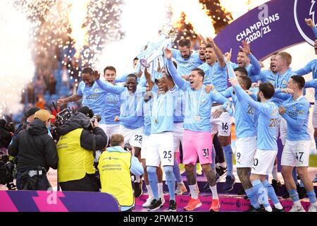 Manchester City's Fernandinho (centre) lifts the Premier League trophy ...