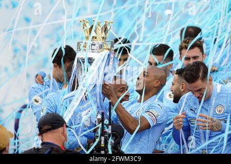 Manchester City's Fernandinho (centre) lifts the Premier League trophy ...
