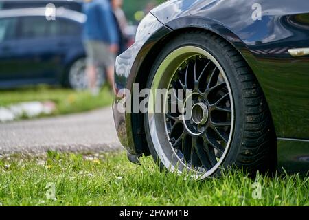 Rear side view front wheel of black car Stock Photo - Alamy