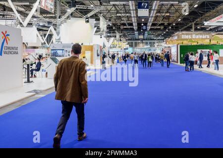 A person at a stand during the International Tourism Fair (Fitur), at ...