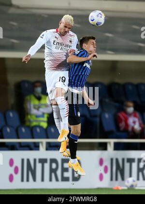 BERGAMO, ITALY - MAY 23: Theo Hernandez of AC Milan and Joakim Maehle ...