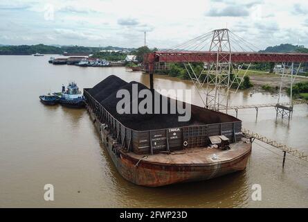 loading coal into barges from stock pile aerial view Stock Photo - Alamy