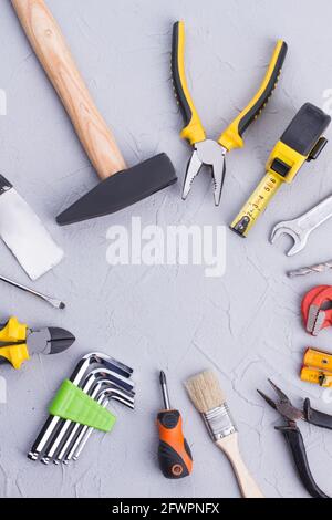Various household tools such as hammer and tape measure screwdriver ...