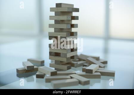 Wood Jenga on glass table Stock Photo - Alamy