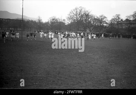 1950s, historical, a group of schoolboys outside in a field at a PE ...
