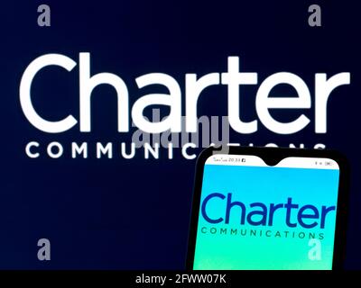 In this photo illustration, the Charter Communications logo is seen displayed on a smartphone ...